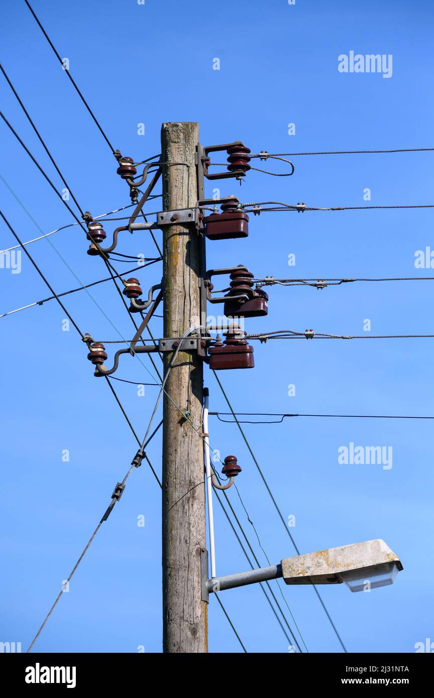 Hamburg, Germany. 27th Mar, 2022. A pole with several power lines in ...