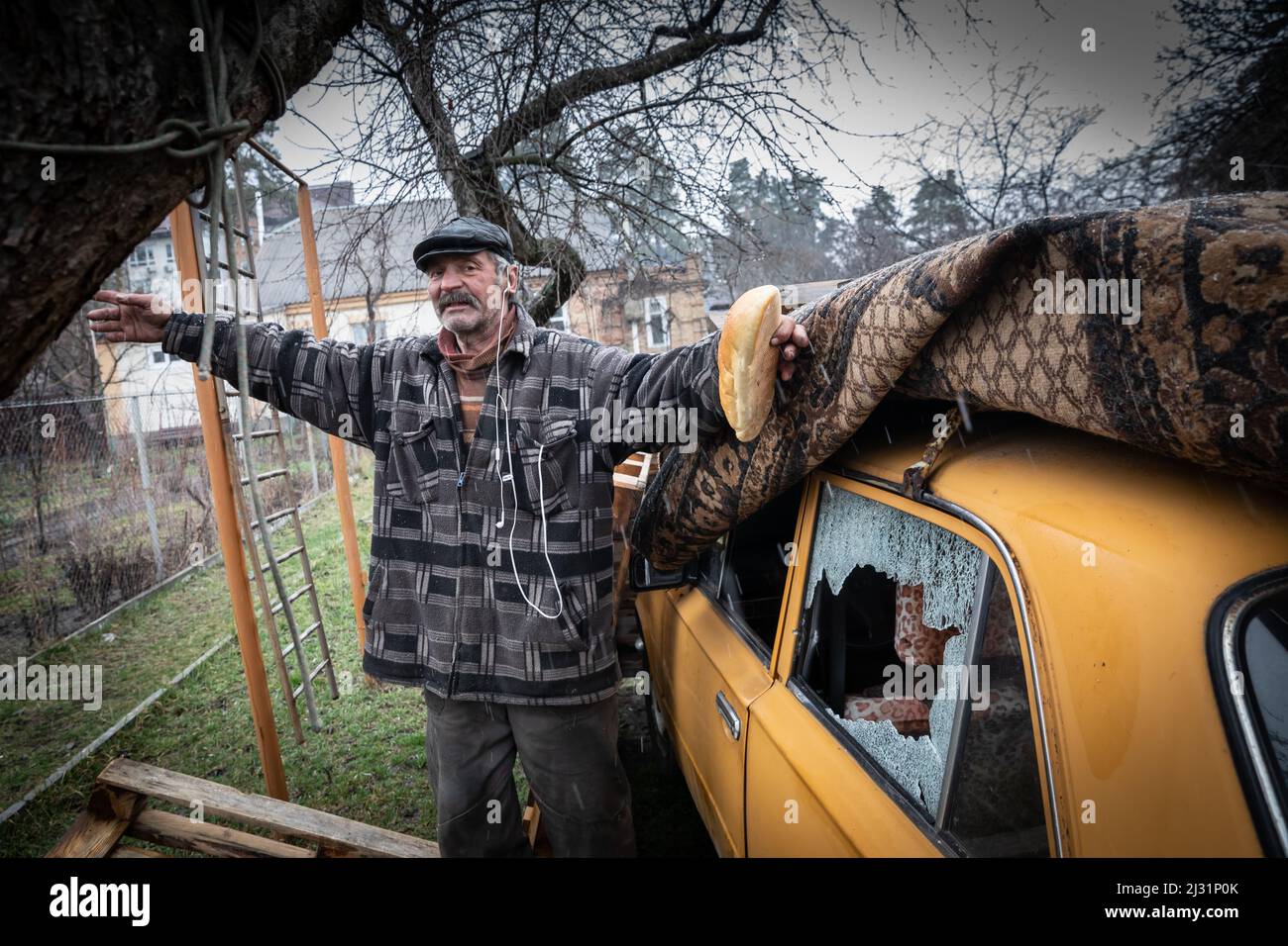 man shows where the rocket arrived that destroyed his car in Bucha ...