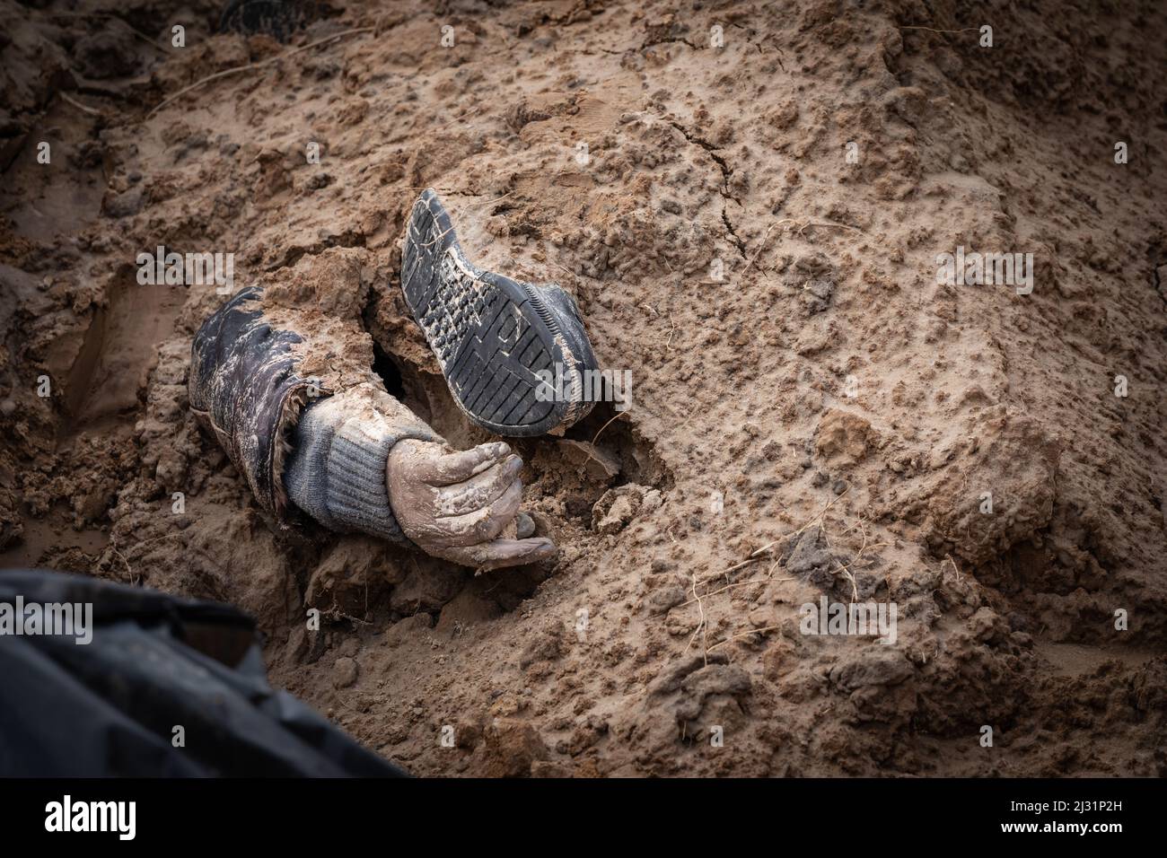 A mass grave in the town of Bucha, Ukraine, where approximately 300 ...