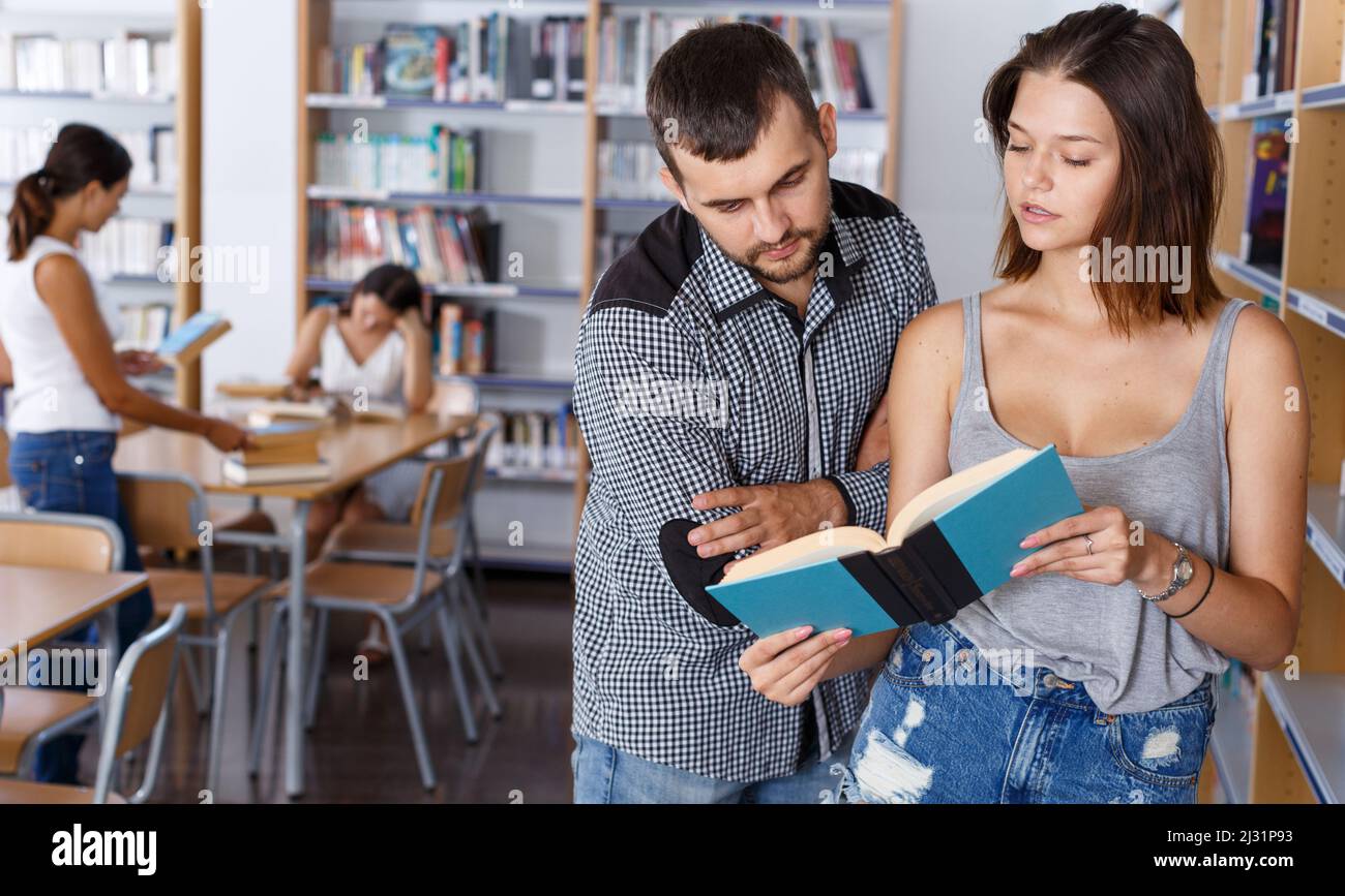 Students reading books in library Stock Photo - Alamy