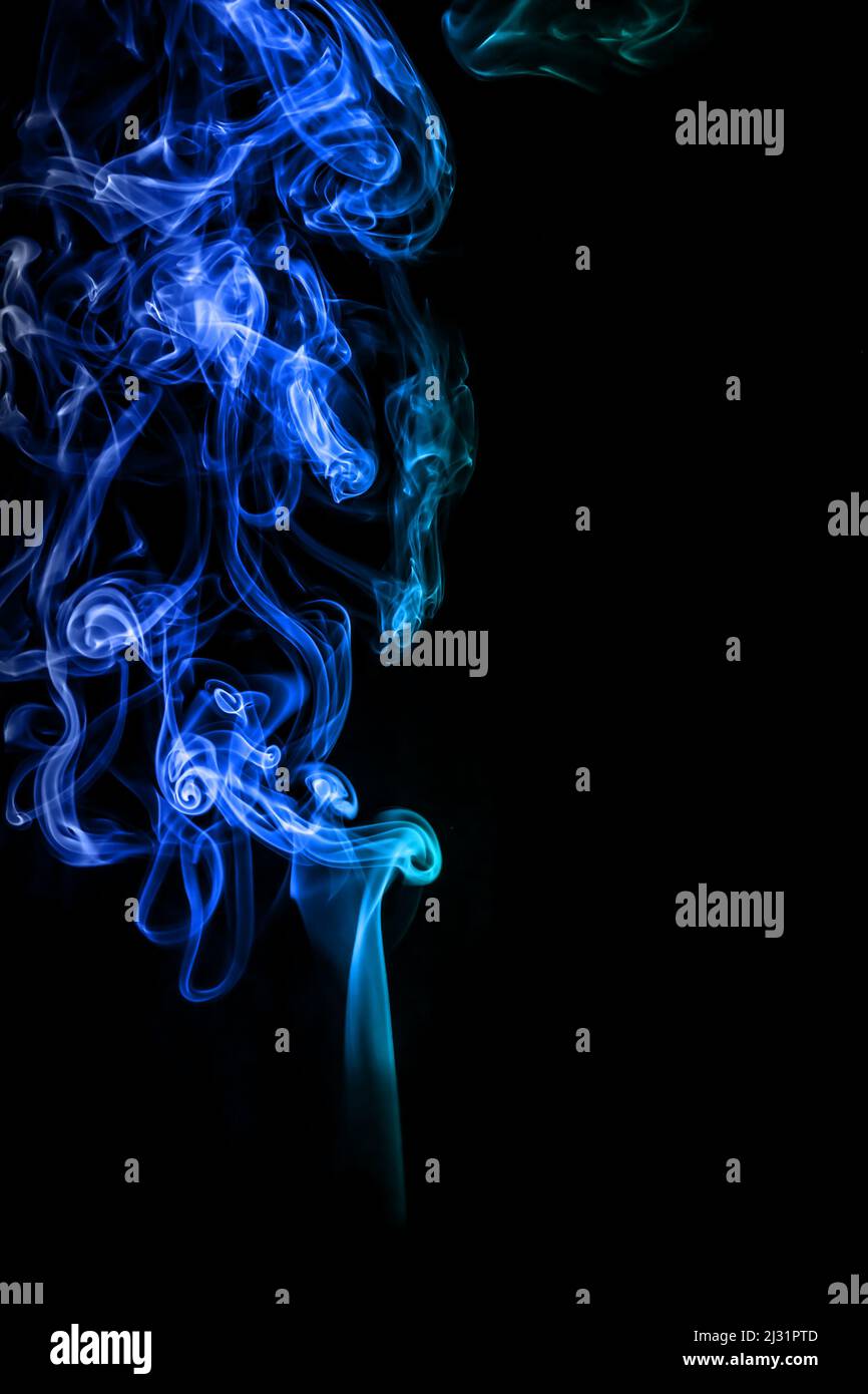 Blue smoke on a black background Stock Photo - Alamy