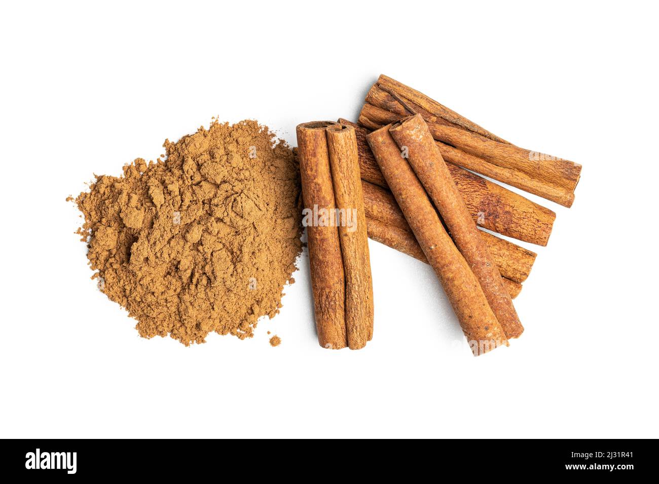 Dry cinnamon sticks and cinnamon powder isolated on a white background ...