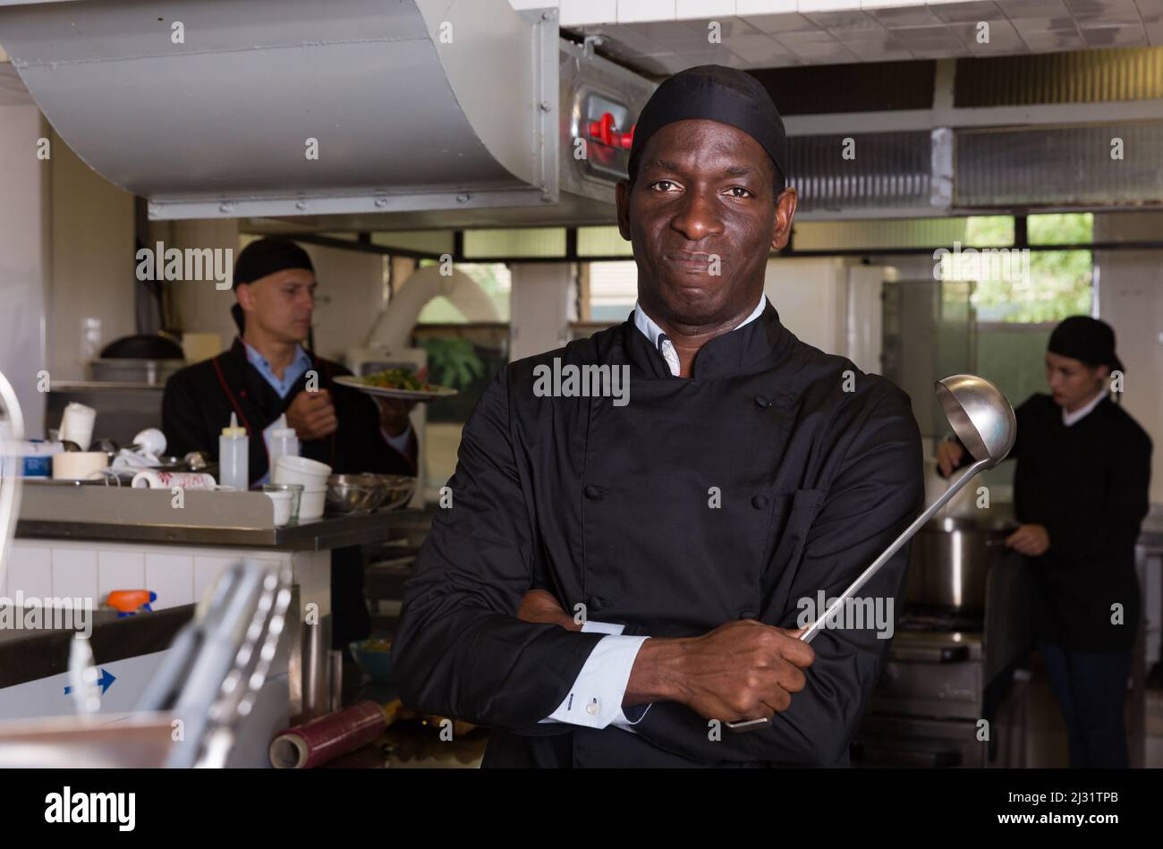 African-American chef in kitchen of restaurant Stock Photo - Alamy