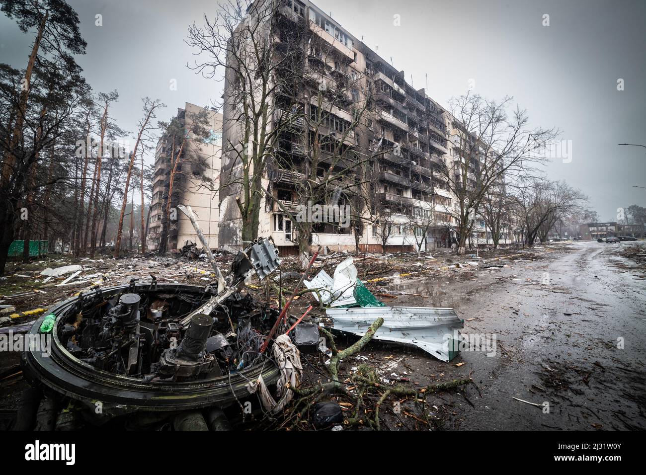 bombed-out housing estate and charred tank in Bucha, Ukraine, pictured ...