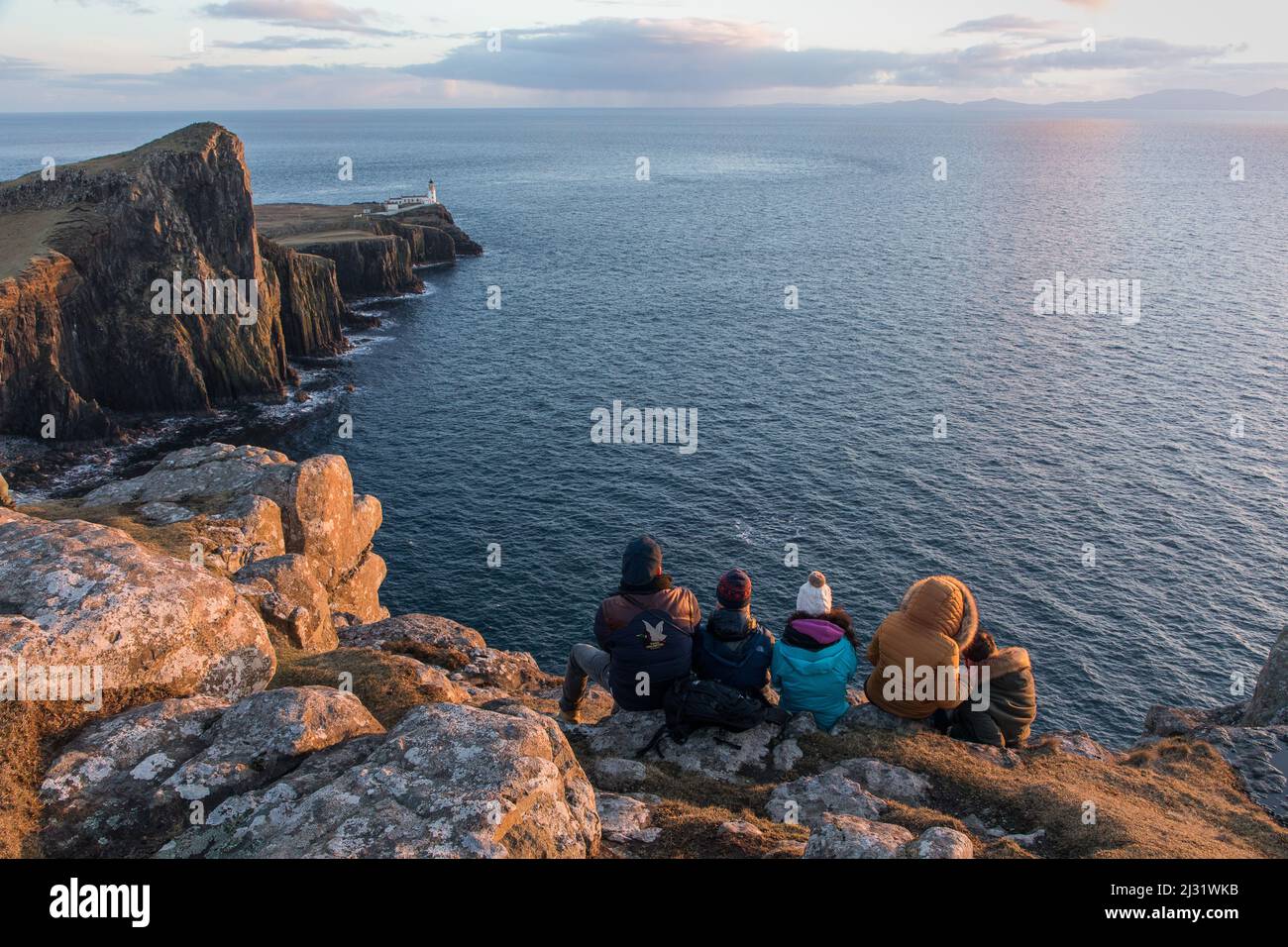 Tourists waiting for sunset in the sea, Neist Point, cliffs and ...