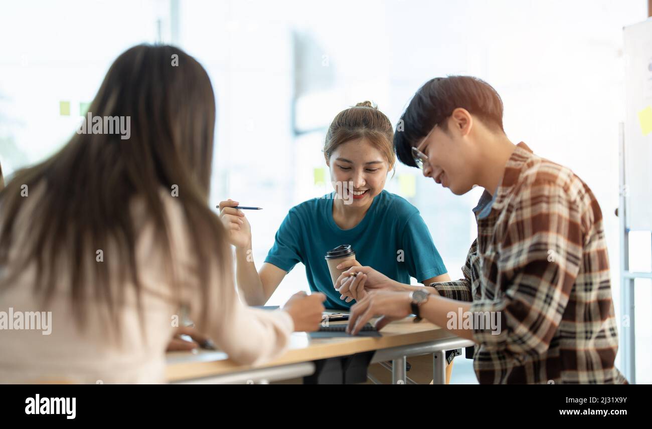 Young Asian woman leading business creative team in mobile application ...