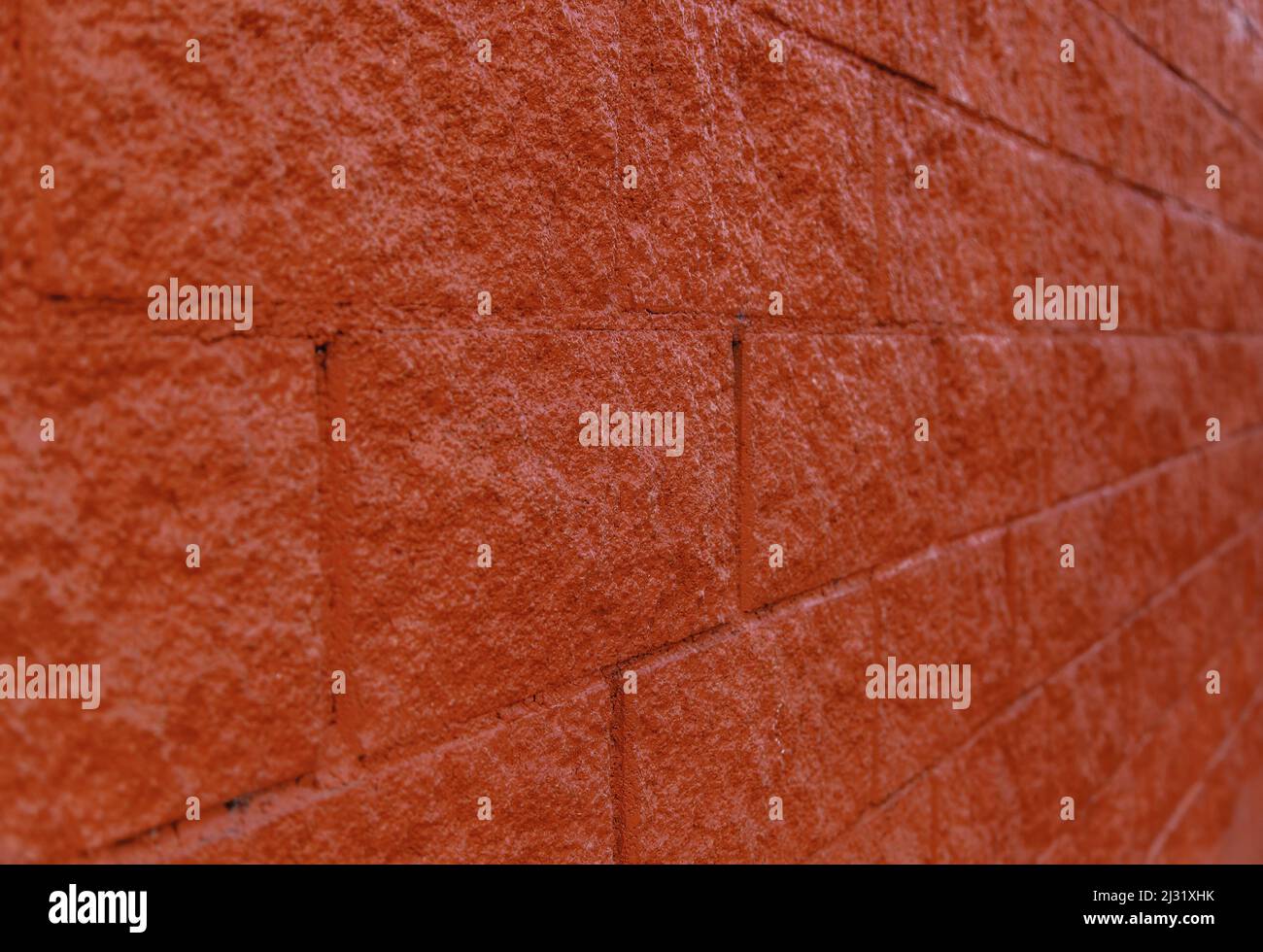 Red painted concrete block wall Stock Photo - Alamy
