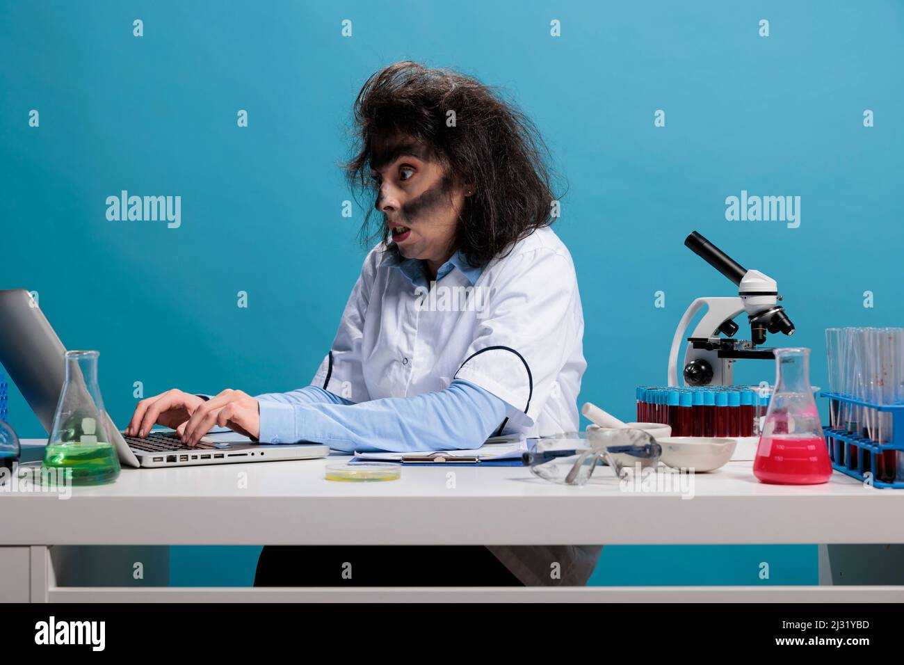 Insane angry biochemist with lunatic look after lab explosion sitting ...