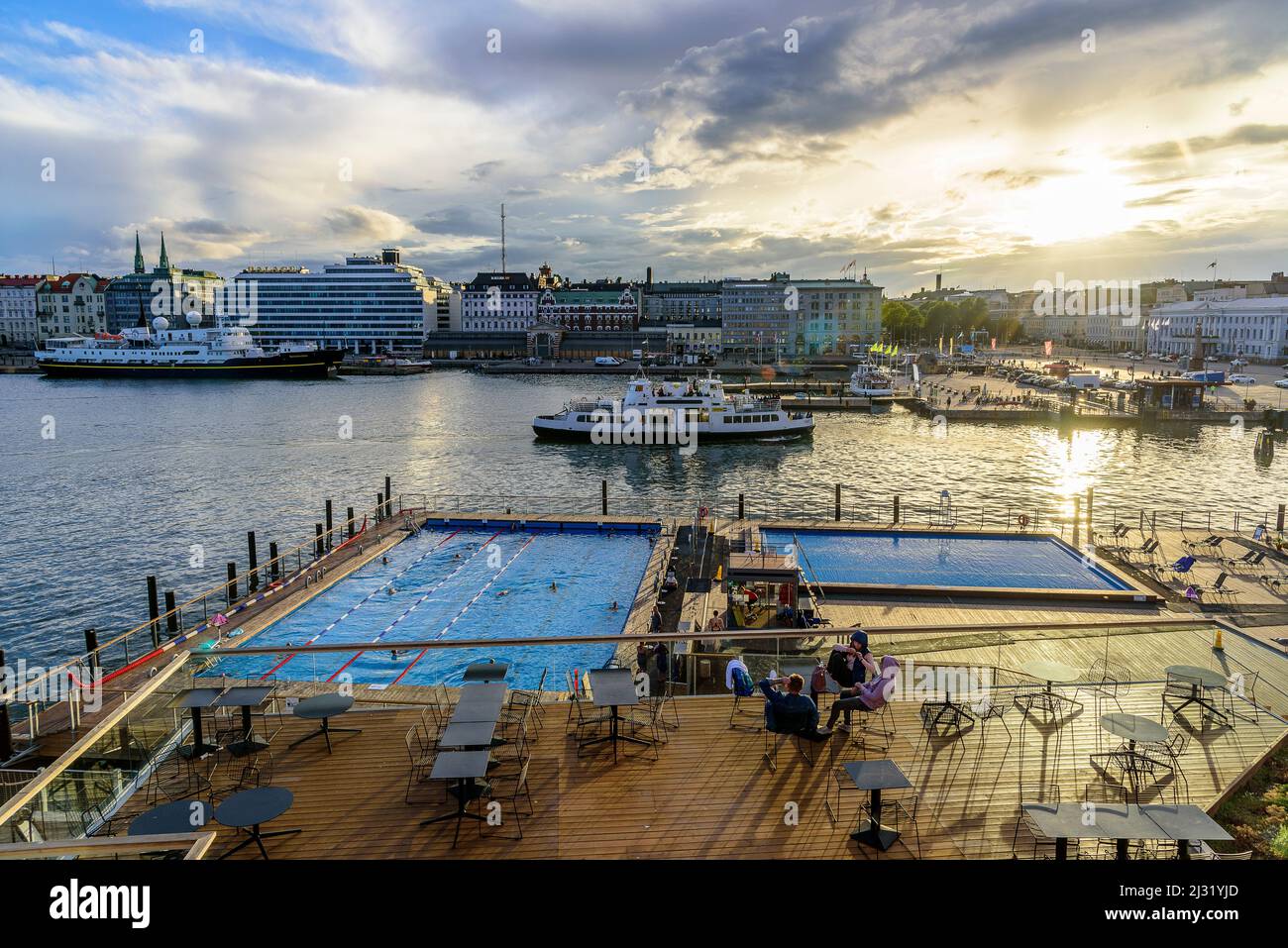 Allas Sea Pool, people bathing in the pool embedded in the harbor basin ...
