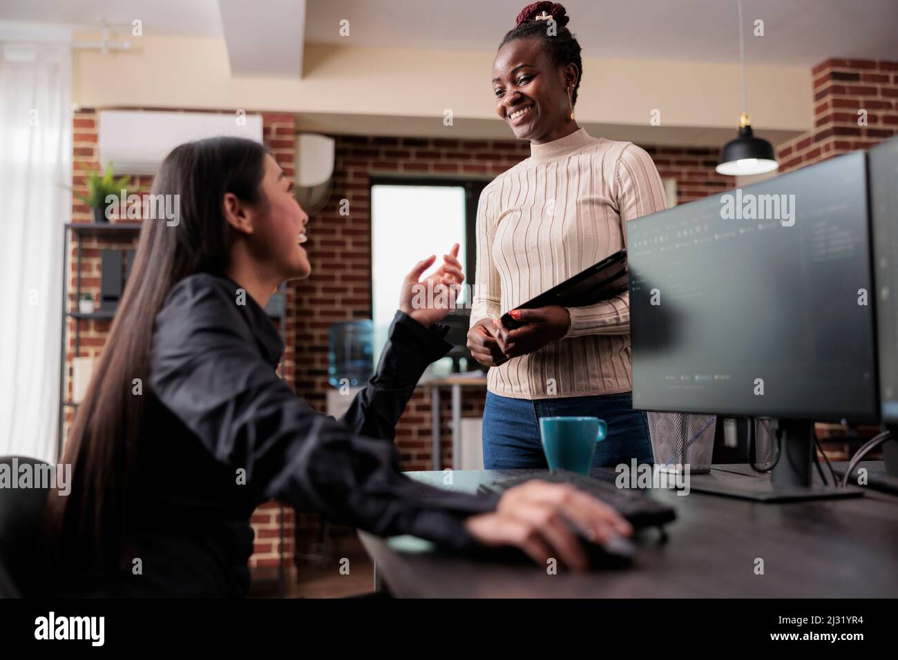 Happy smiling tech developing company workers laughing at funny hacker ...