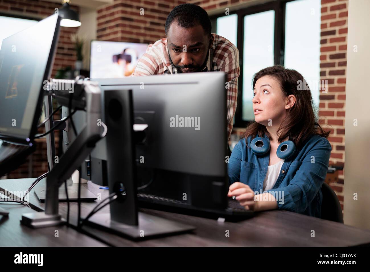 Confident man pointing out mistakes in design blueprint while having ...