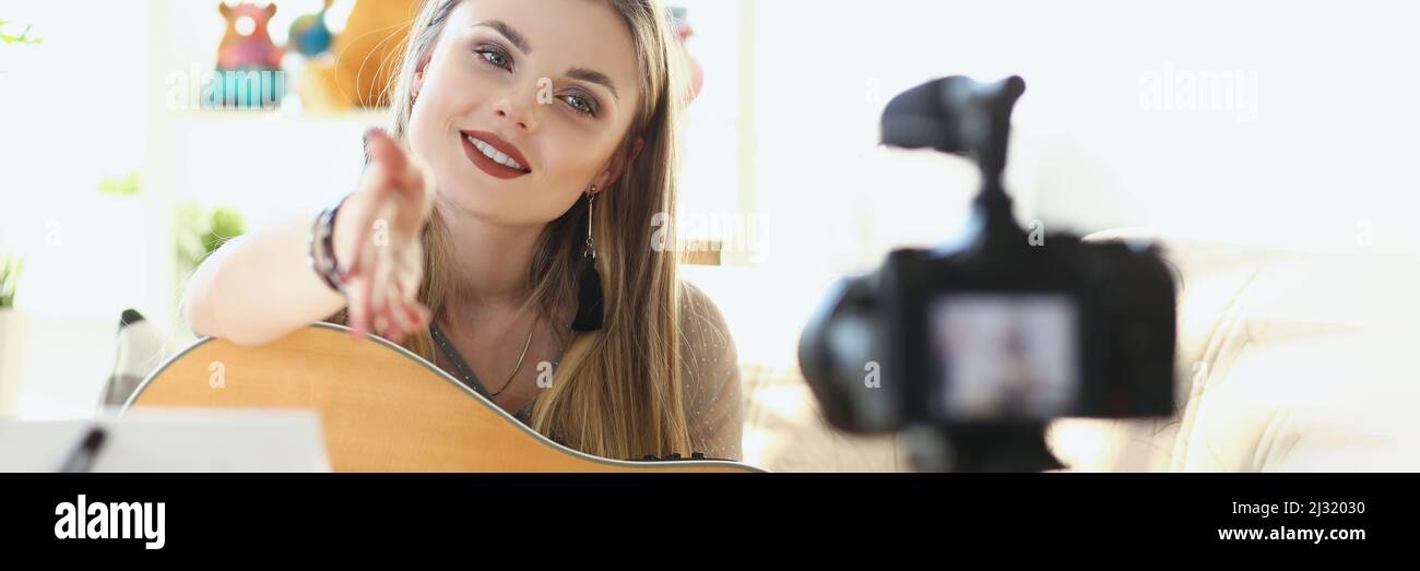 Cute musician filming musical clip Stock Photo - Alamy