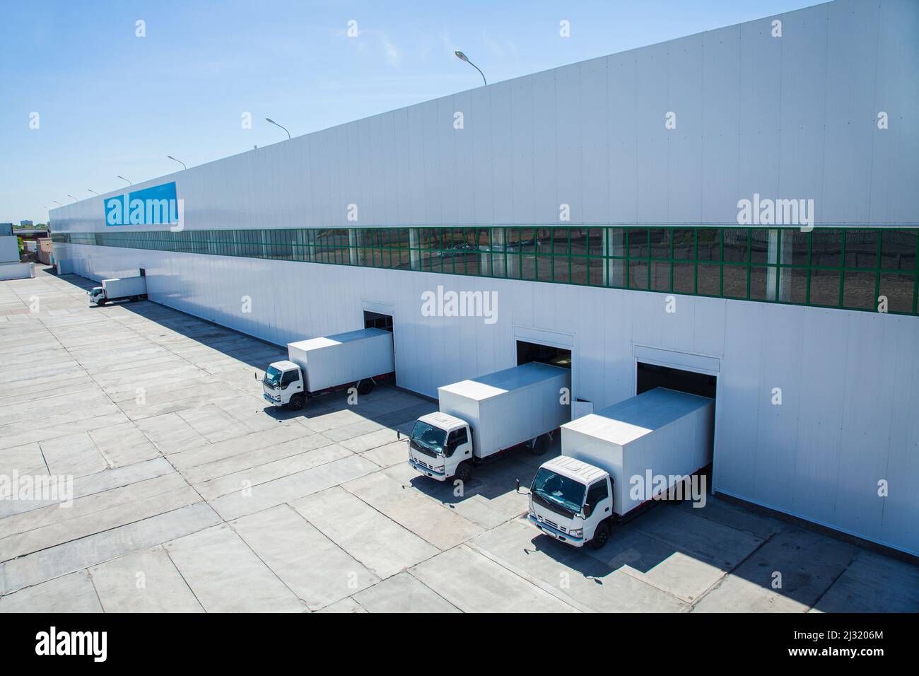A perspective shot of some tracks coming out of a minimalist warehouse ...