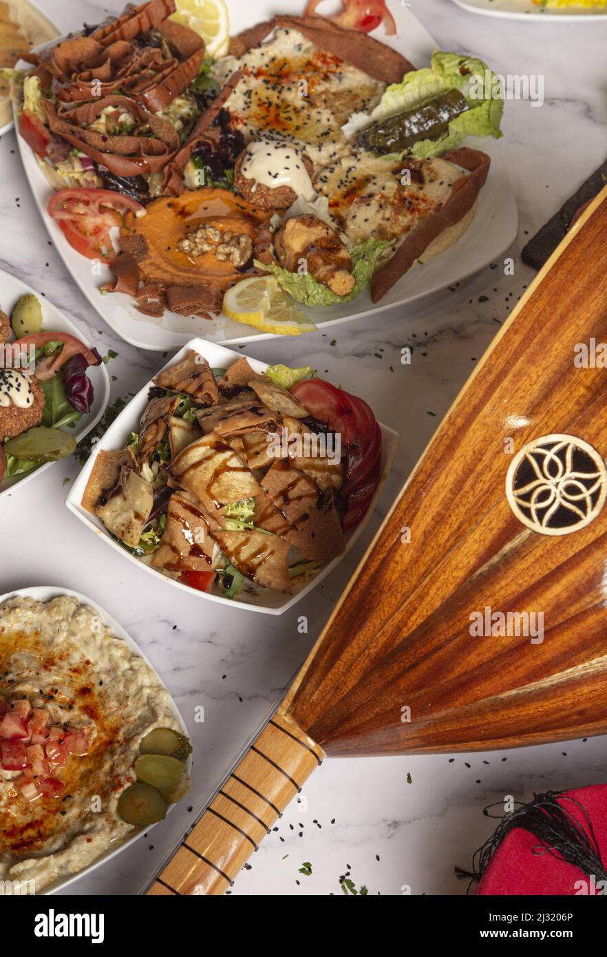Close up of variety of middle eastern food dishes with arabic props ...