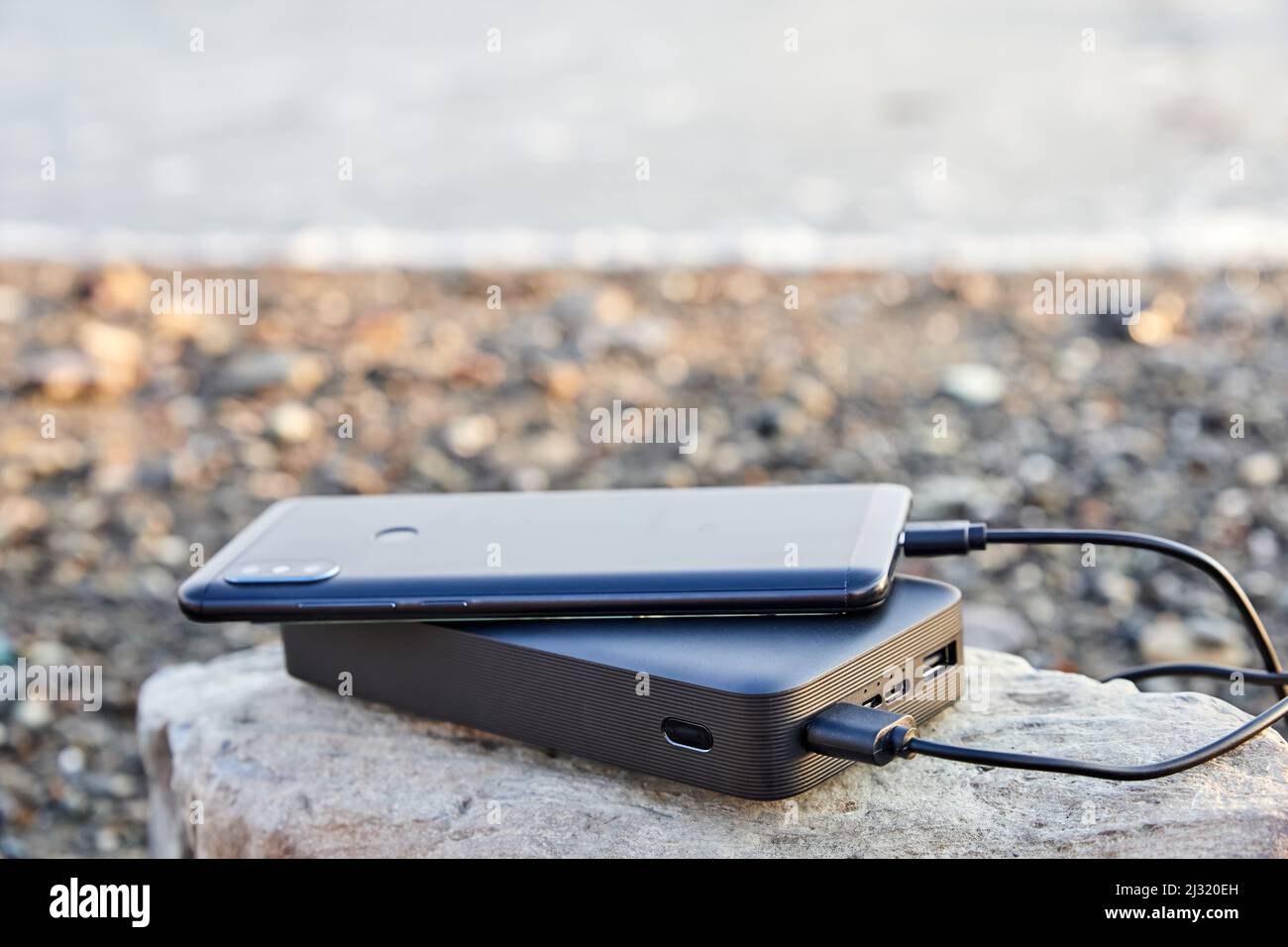 Bag that charges phone hi-res stock photography and images - Alamy