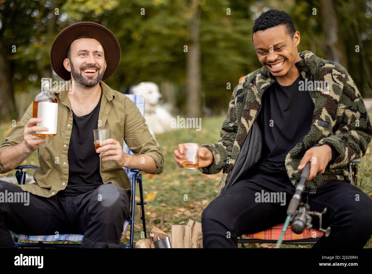 Men drinking alcohol while fishing Stock Photo - Alamy