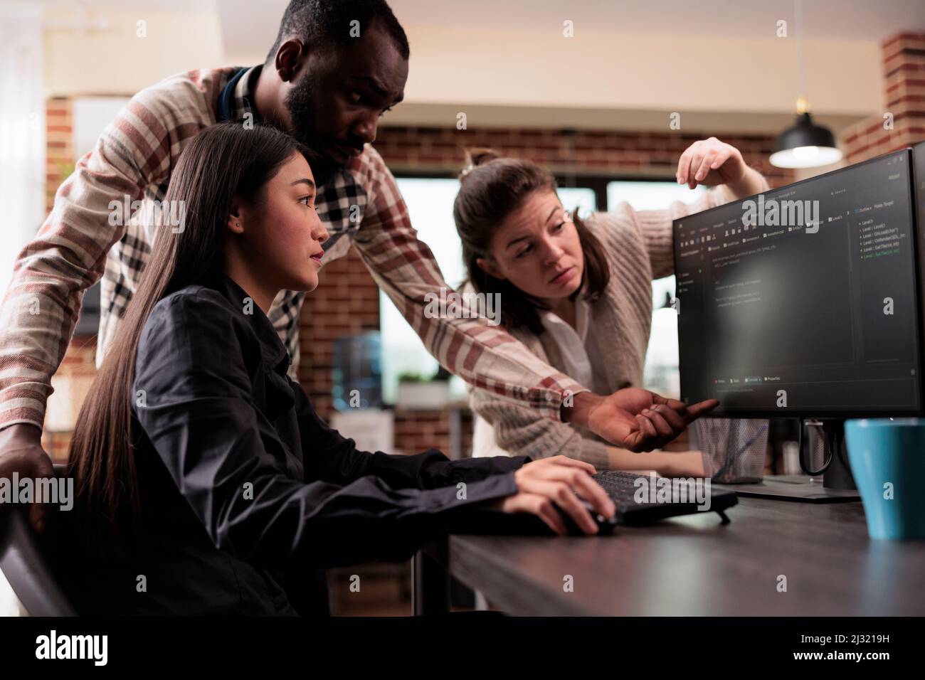 Cyber security agency multiethnic team encrypting mainframe database using computing technology ...