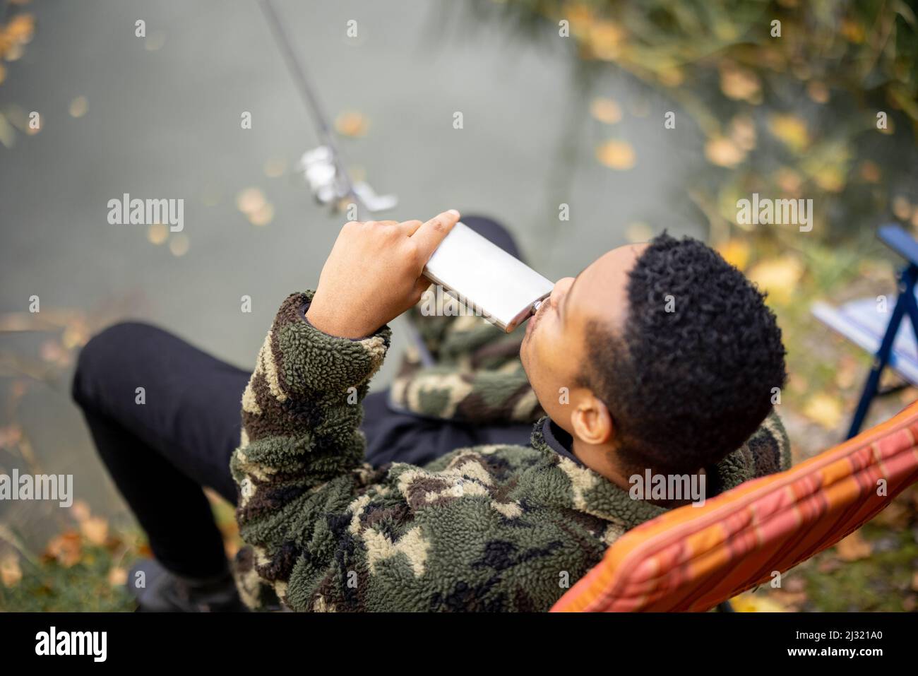 Fishing sitting flask hi-res stock photography and images - Alamy