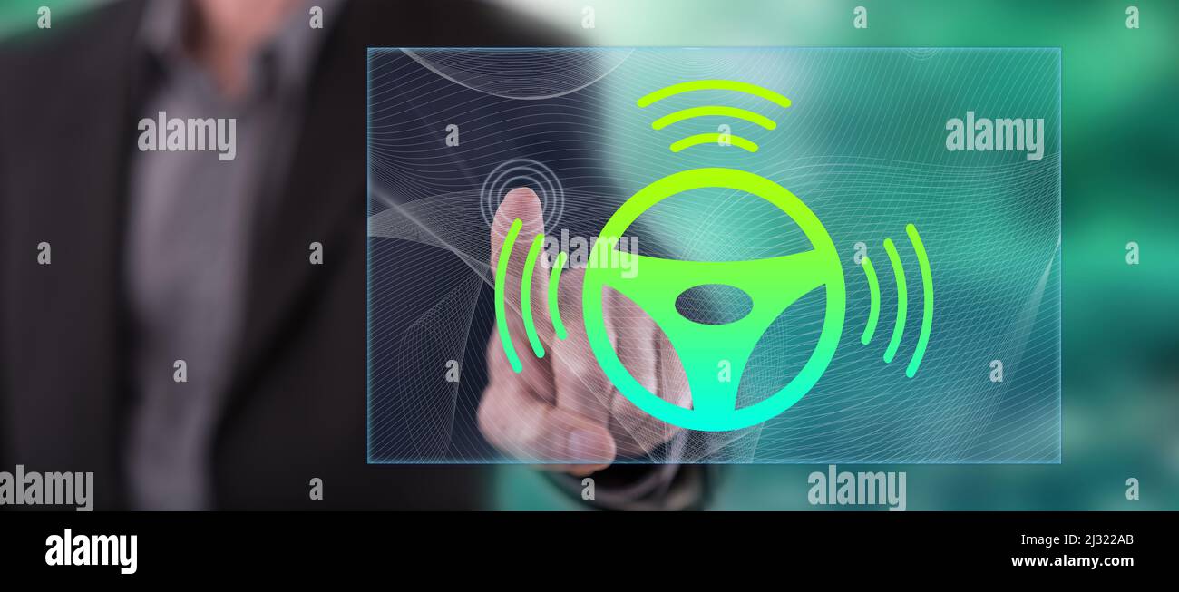 Man touching a self-driving car concept on a touch screen with his ...