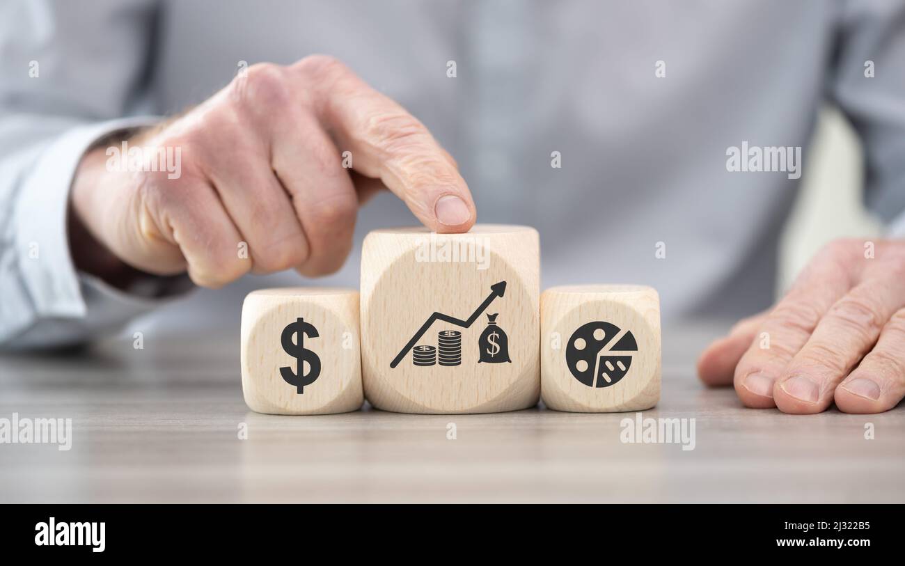 Wooden blocks with symbol of profit concept Stock Photo - Alamy