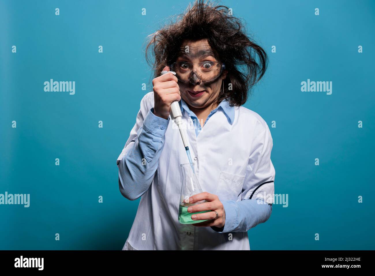 Crazy mad scientist using pipette to drip chemical compound inside ...