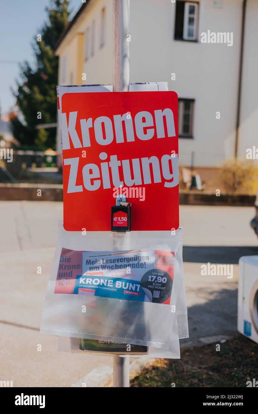 A vertical closeup of the street stand of Austrian newspapers Kronen ...