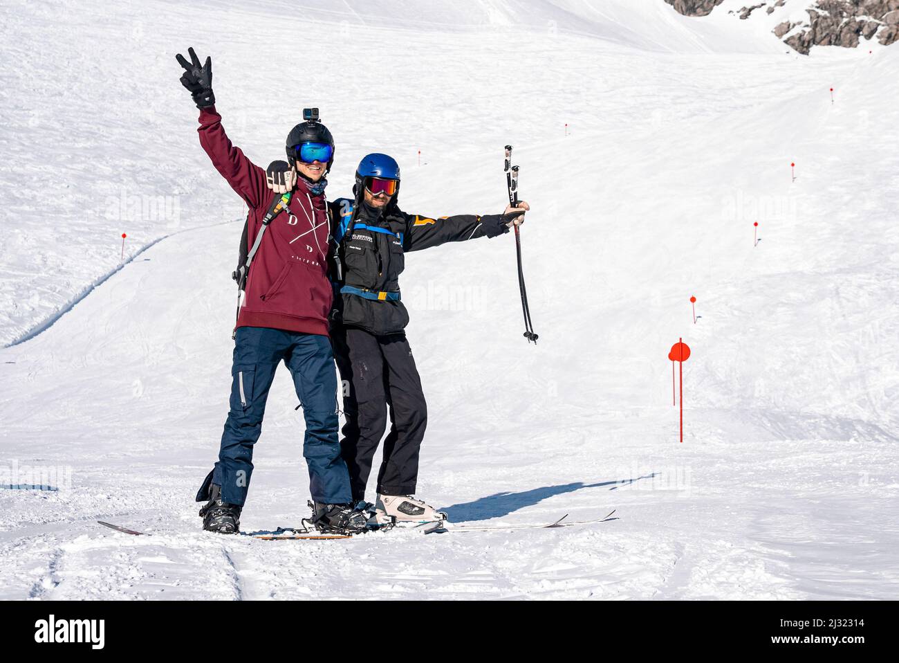 Skier standing at the ski slope holding ski hi-res stock photography ...
