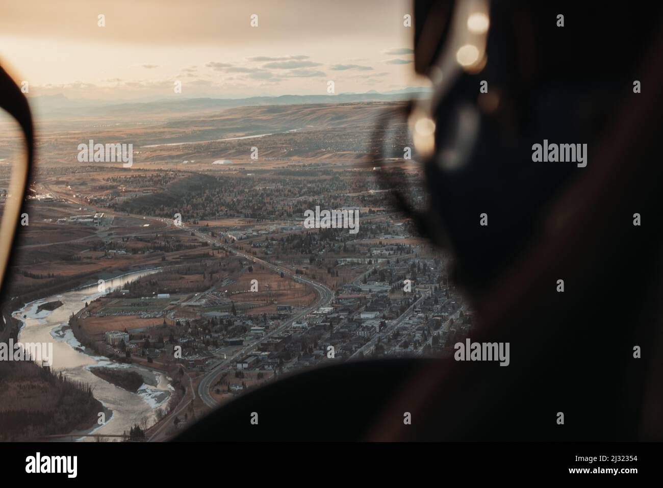 Landscape scenery viewed over the shoulder of a helicopter pilot Stock ...