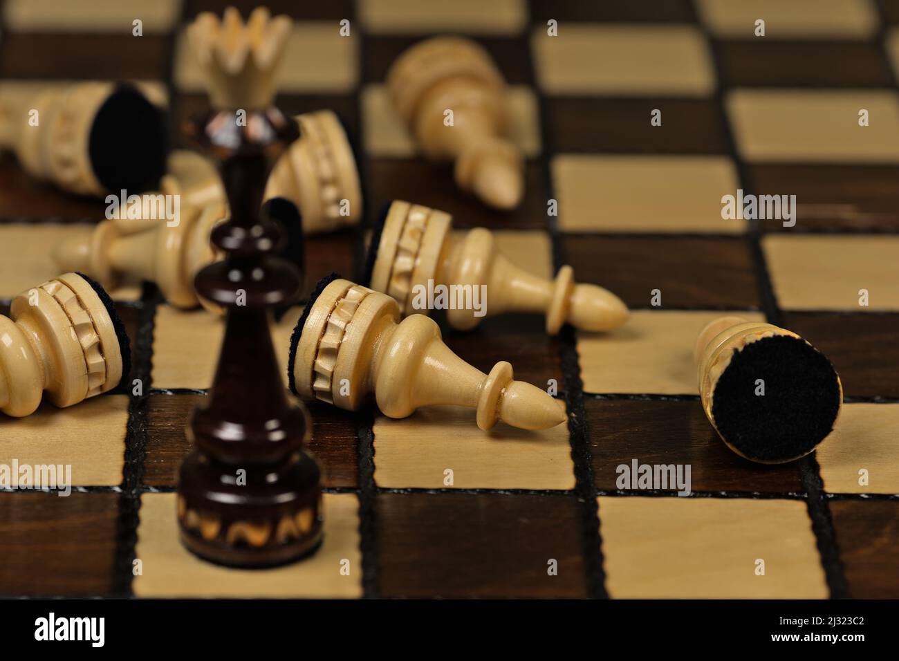 Chess pieces lying on chess board hi-res stock photography and images ...