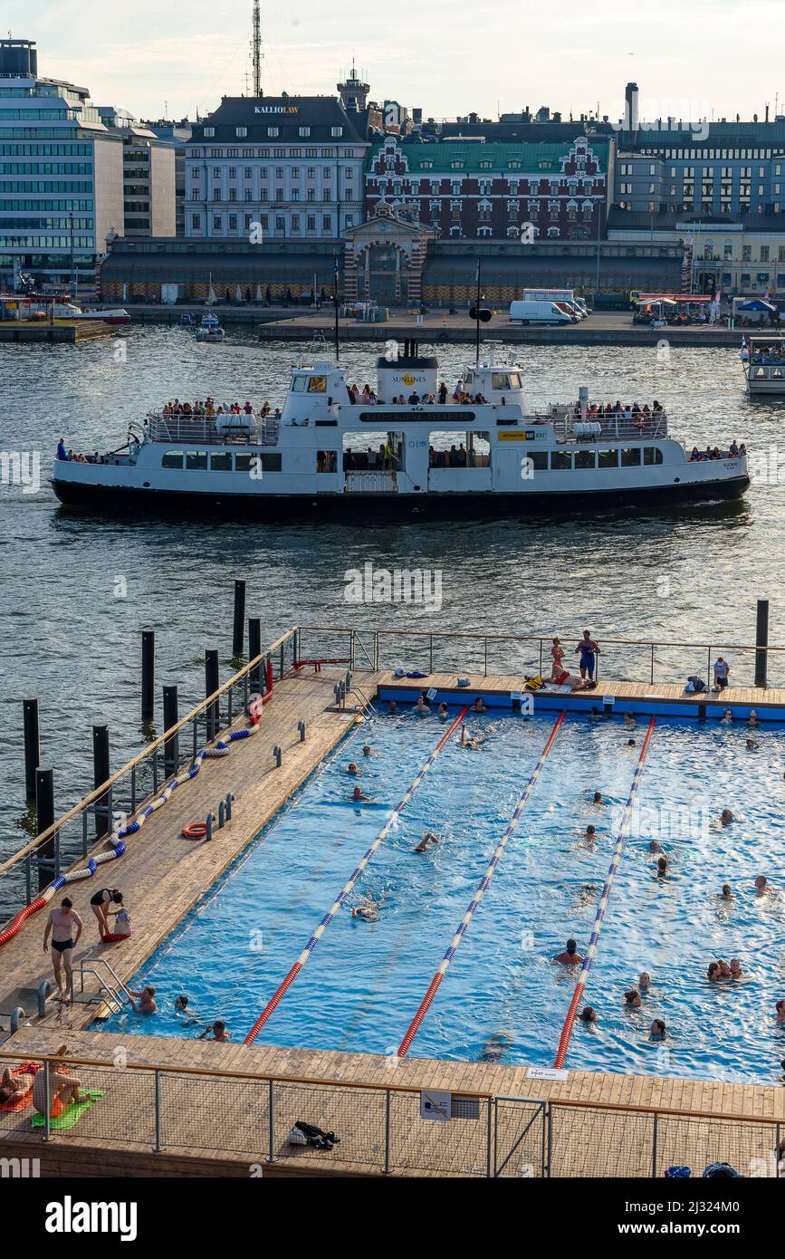 Allas Sea Pool, people bathing in the pool embedded in the harbor basin ...