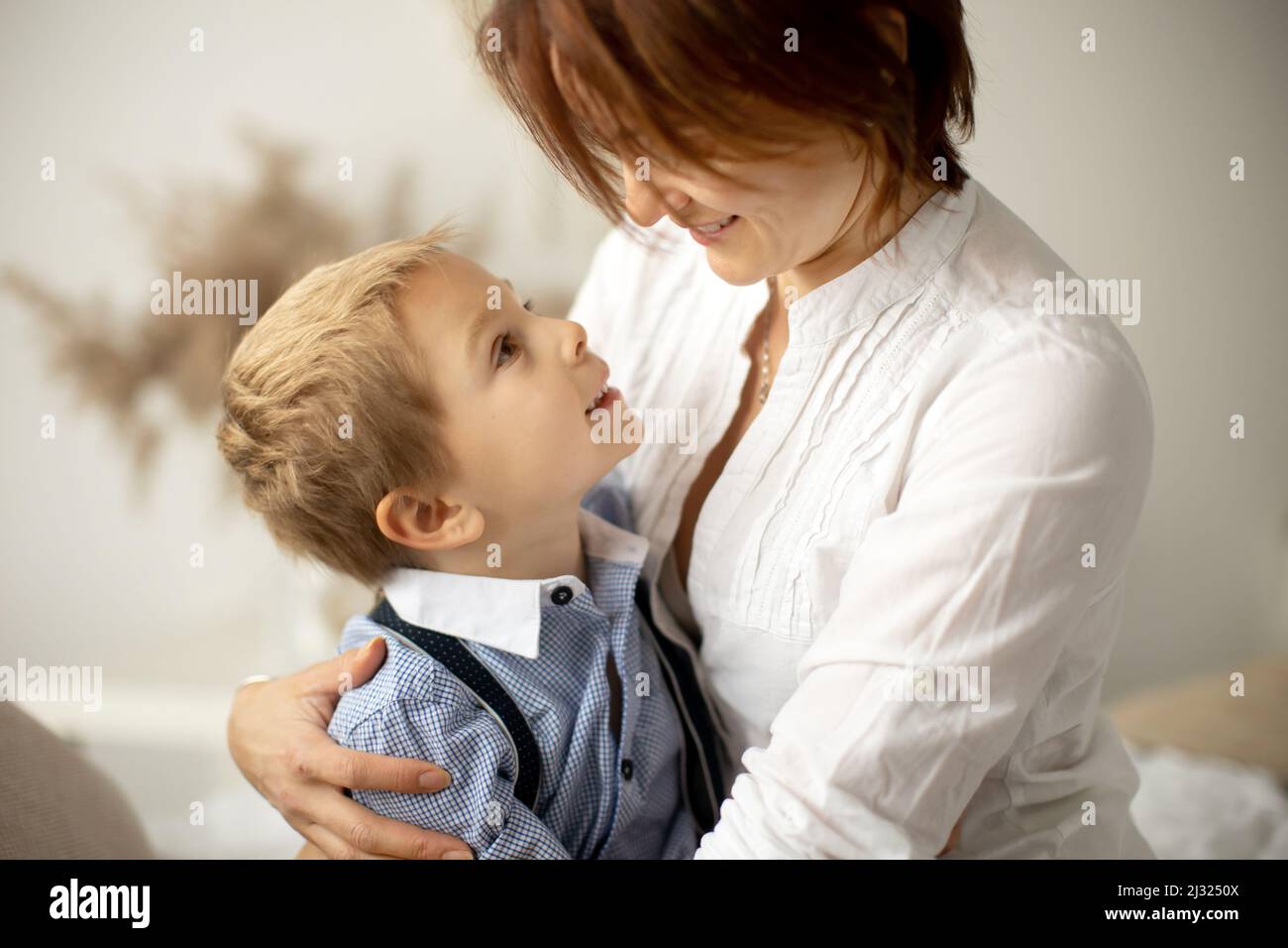 Mother and child, blond fashion preschool boy, having a wonderful ...