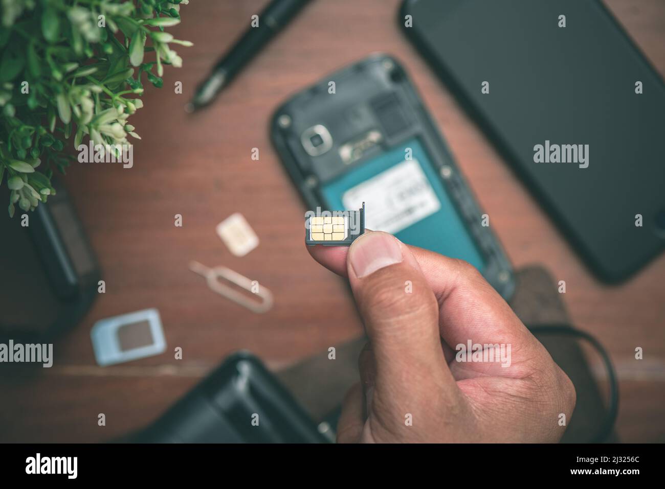Changing sim hi-res stock photography and images - Alamy