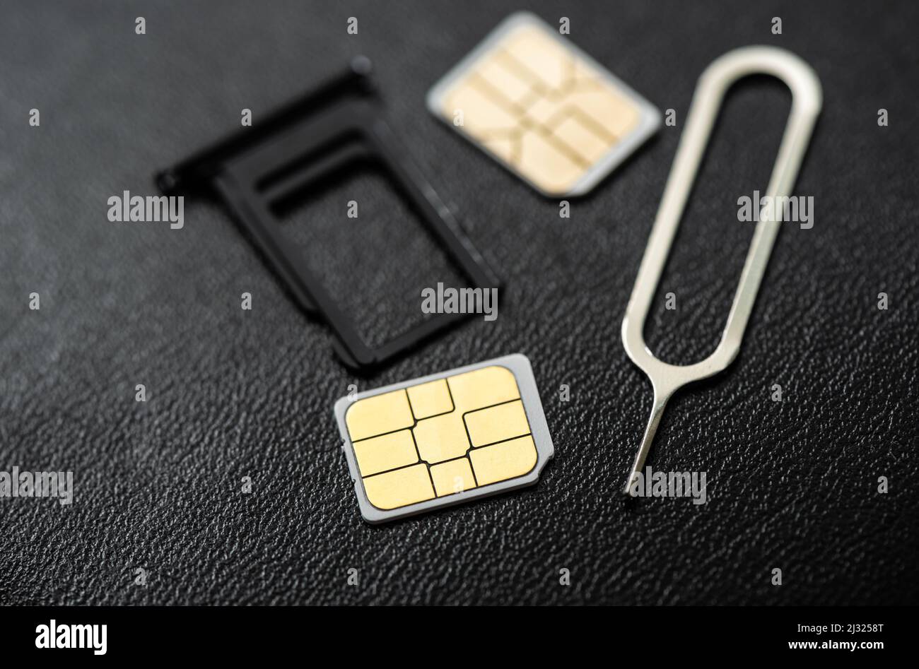SIM card for smart phone. Changing the SIM card Stock Photo - Alamy