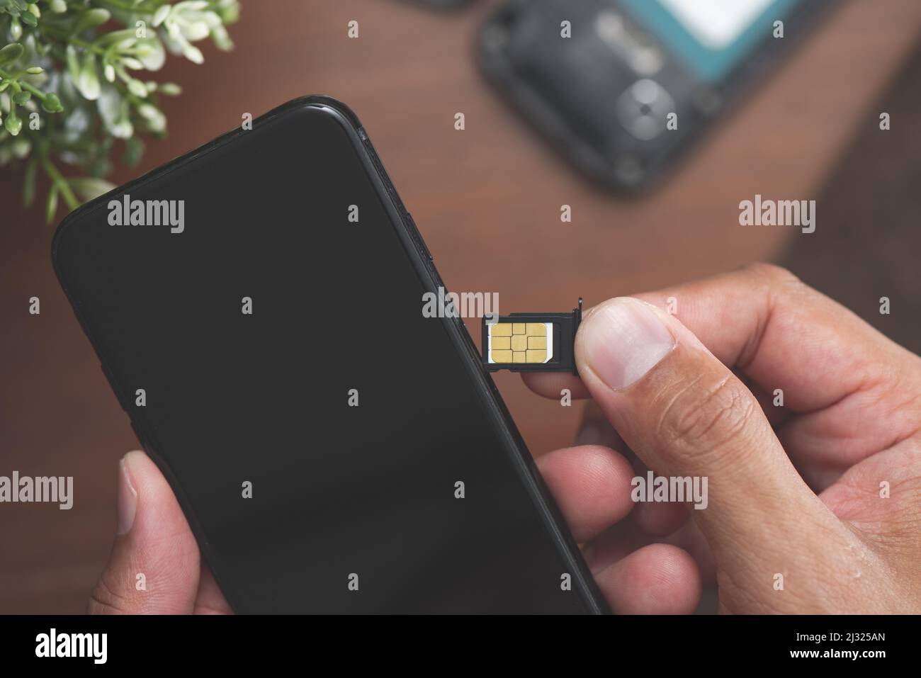 Changing sim hi-res stock photography and images - Alamy