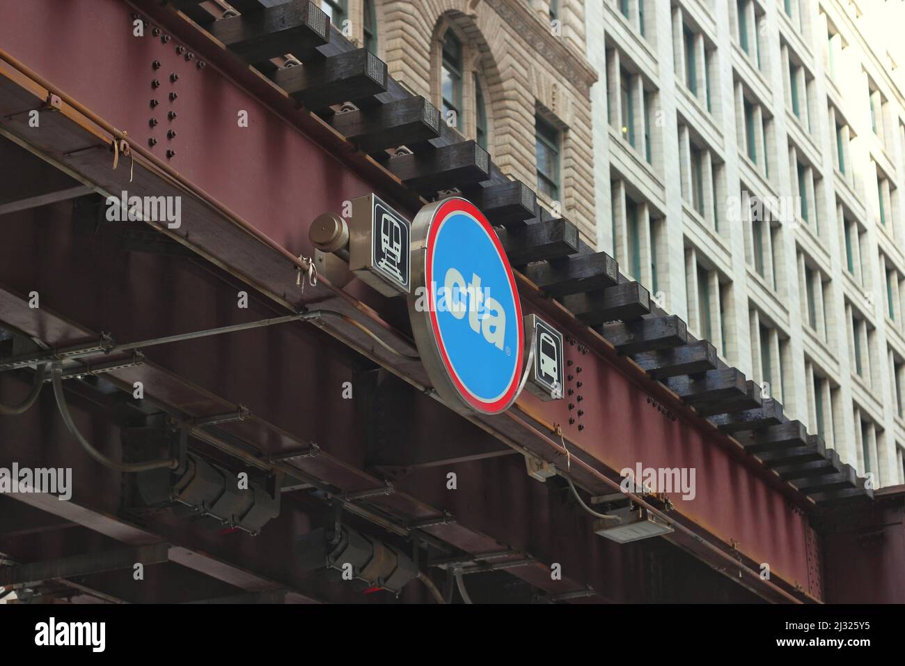 The red and blue CTA sign hanging on the side of the elevated train ...
