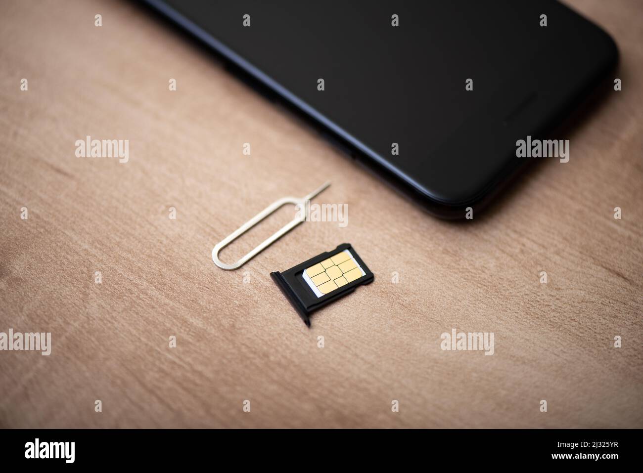 SIM card for smart phone. Changing the SIM card Stock Photo - Alamy