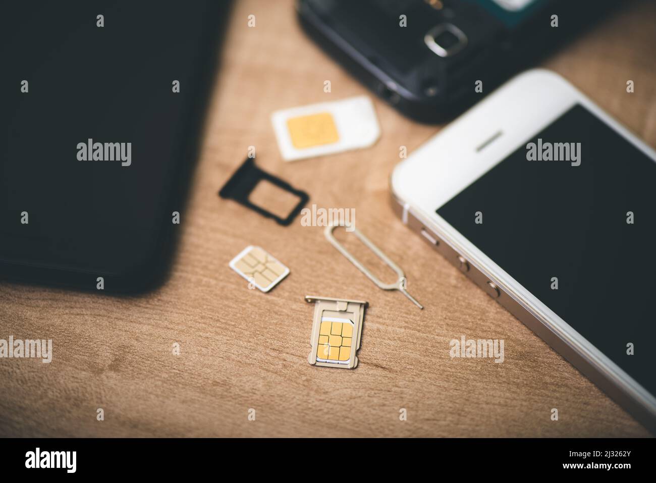 SIM card for smart phone. Changing the SIM card Stock Photo - Alamy