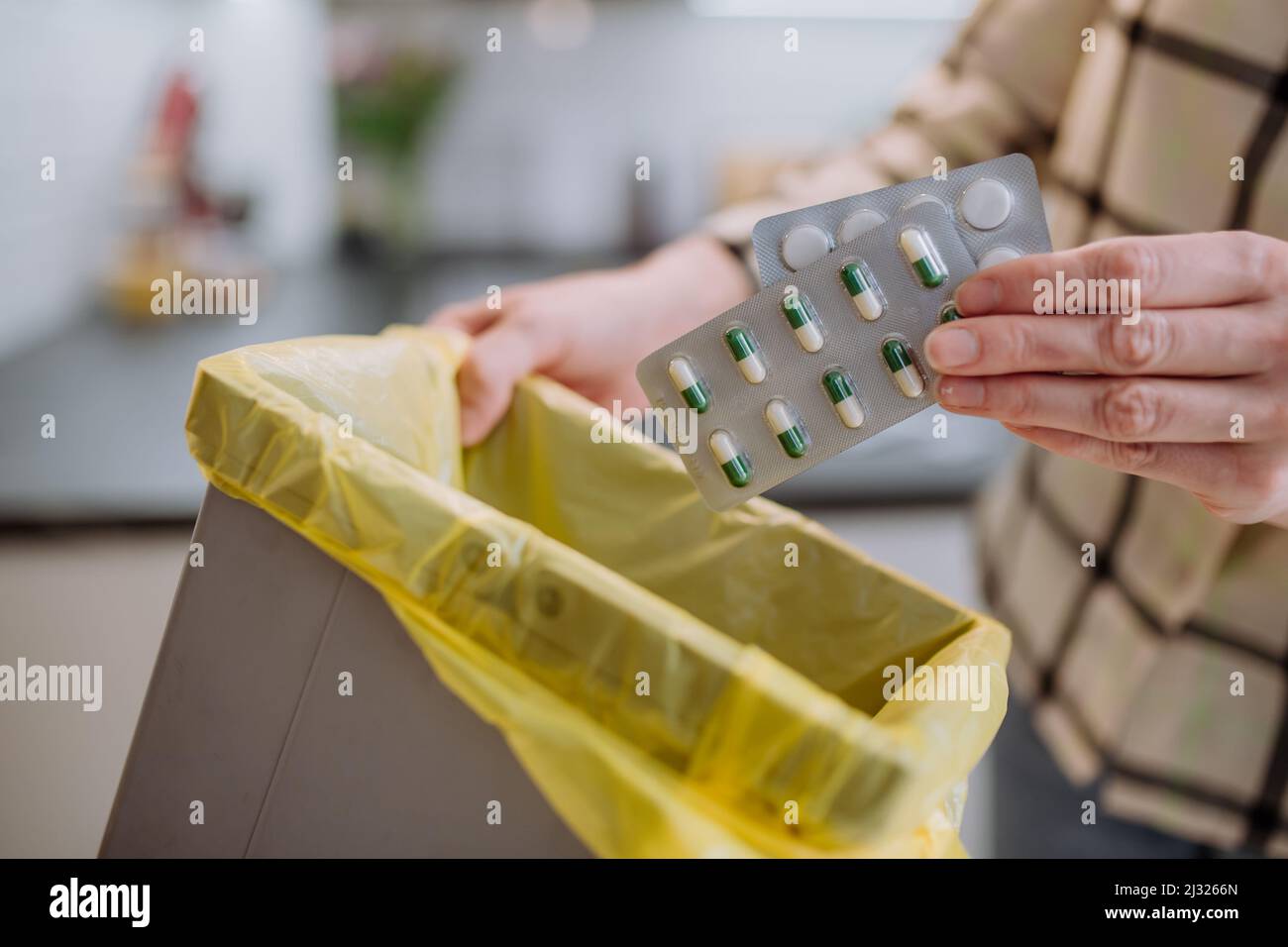 Person throwing away garbage hi-res stock photography and images - Alamy