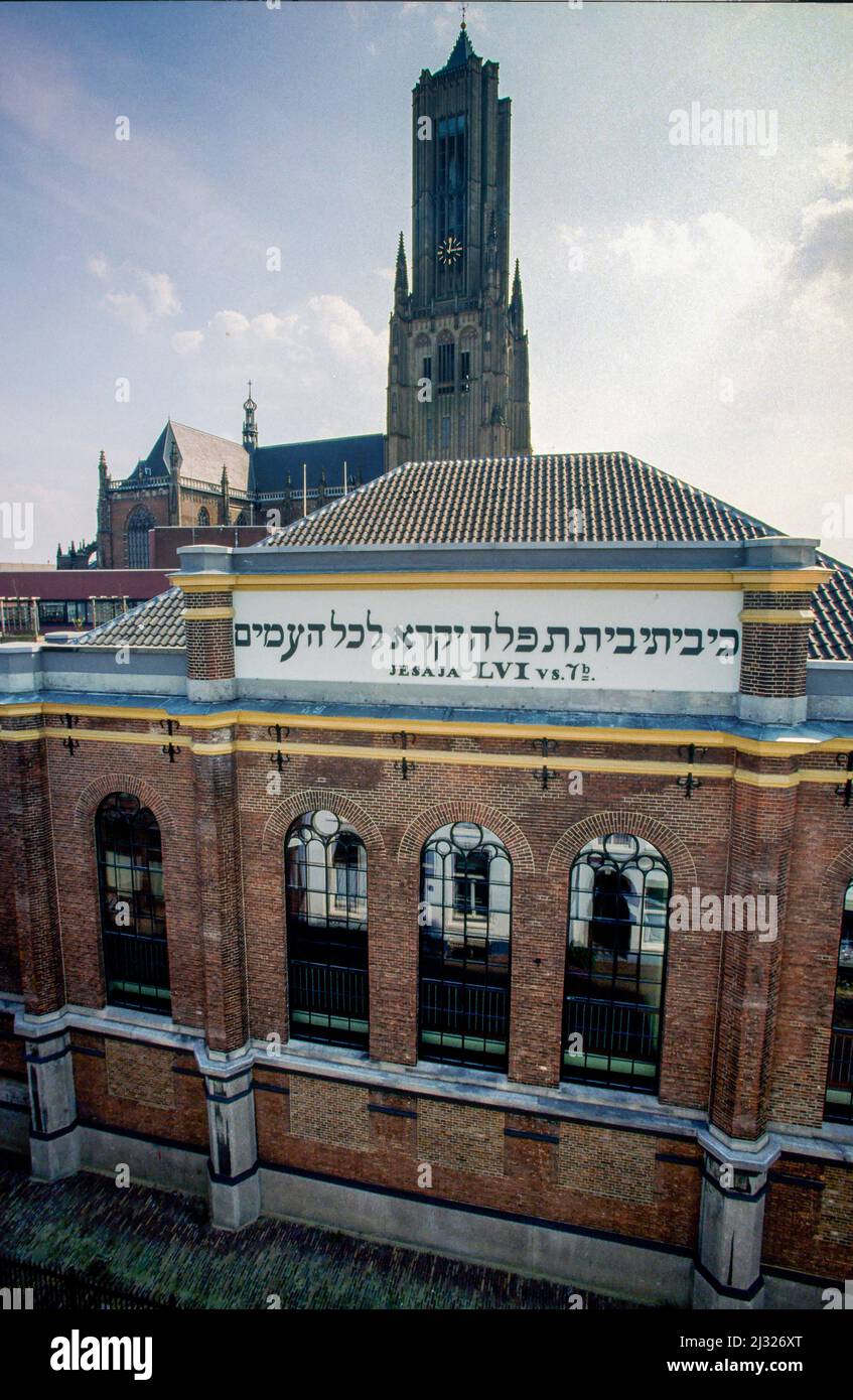 The Netherlands, Arnhem. Synagogue with catholic church in the ...