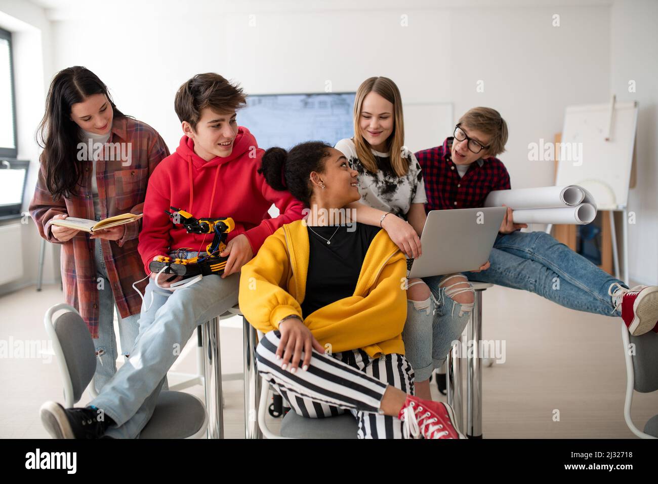 Group of students in classroom studying robotics Stock Photo - Alamy