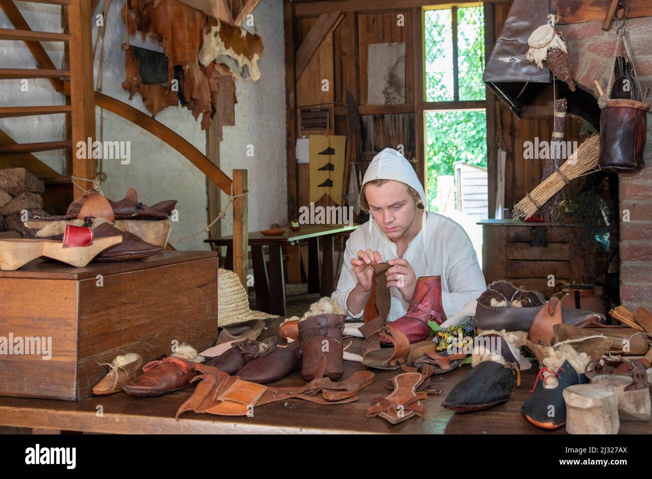 Netherlands, shoemaker in his shop in the middle ages. The Archeon park ...