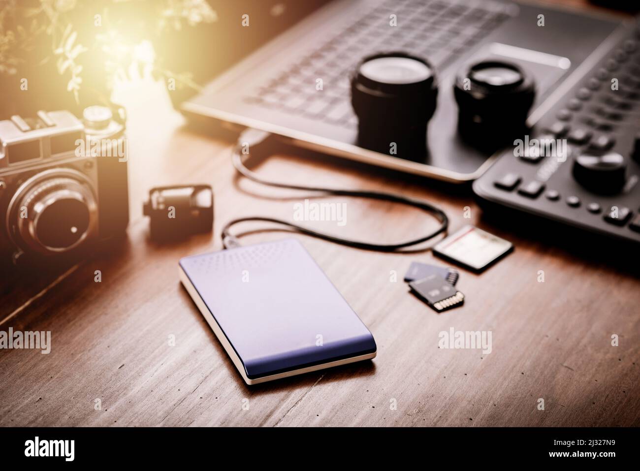 Closeup external hard drive on wooden desktop. Working with external ...