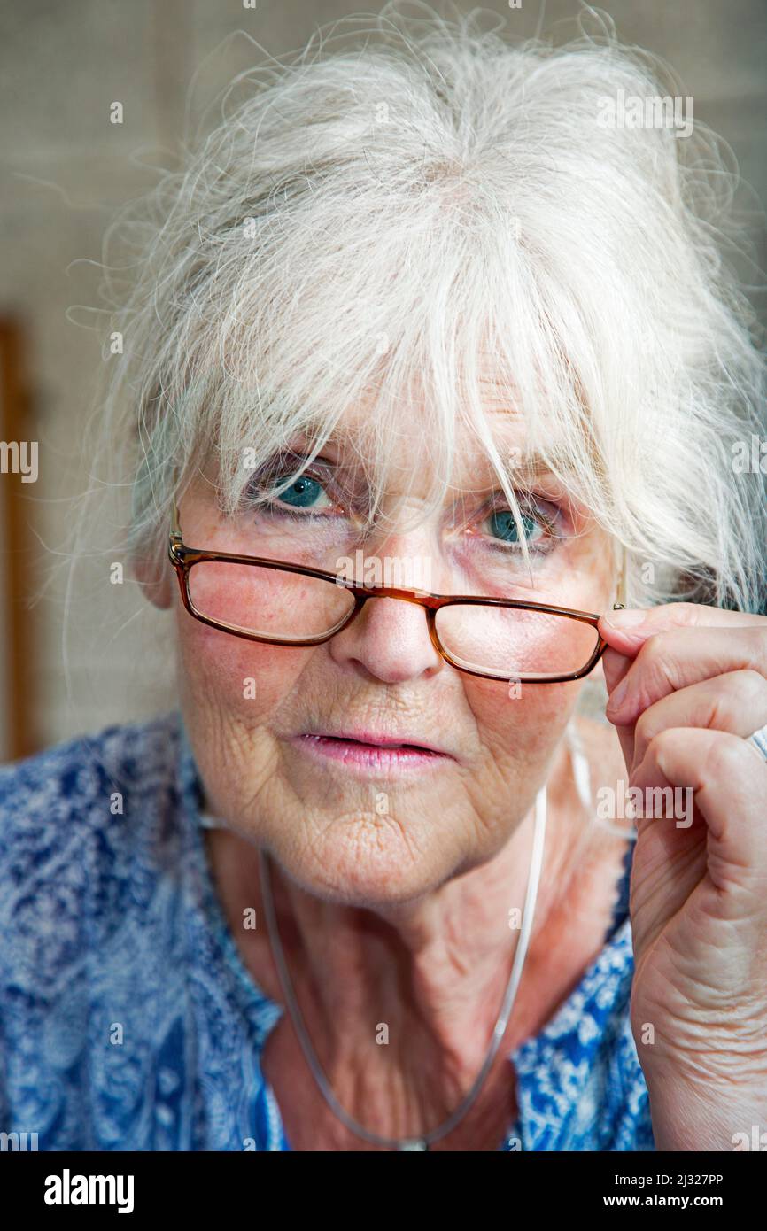 Netherlands, woman of 81 years old with reading glasses Stock Photo - Alamy