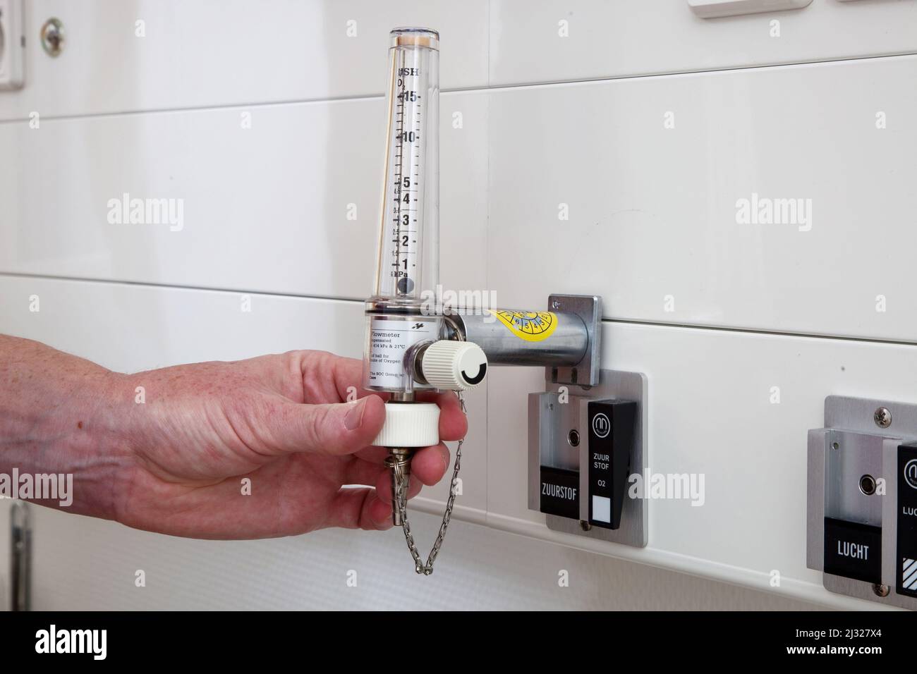 Netherlands, nurse in a hospital is adjusting the oxygen gas for a ...