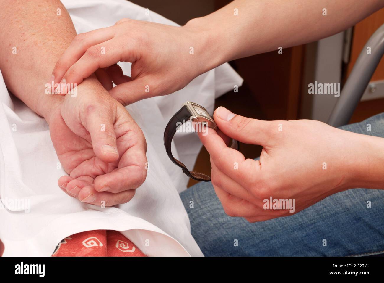 Measuring the heartbeat on the wrist or throat where the artery with a ...