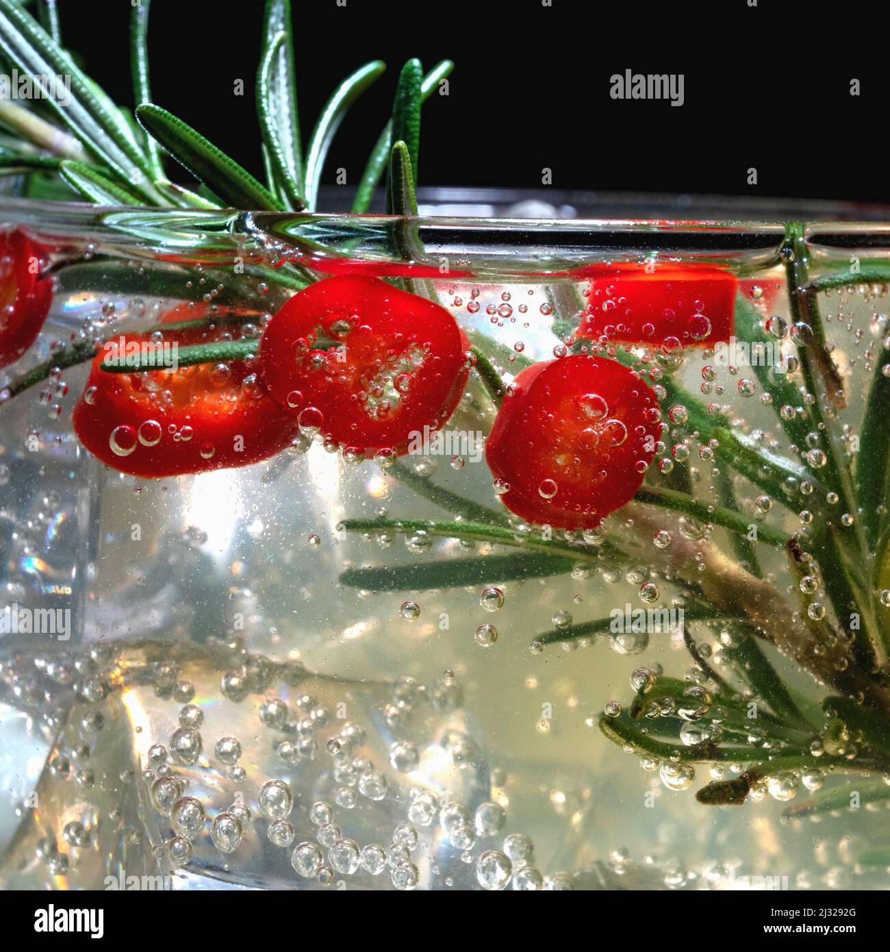 Close-up of alcoholic cocktail with rosemary and red chili. Alcohol bar ...