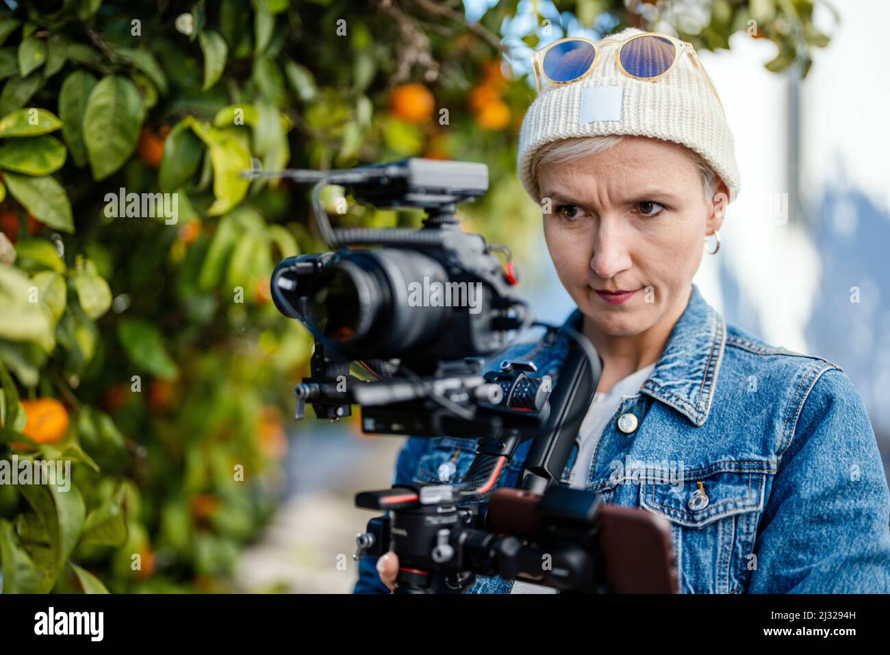 Camera operator with movie setup including a gimbal, video transmitter ...