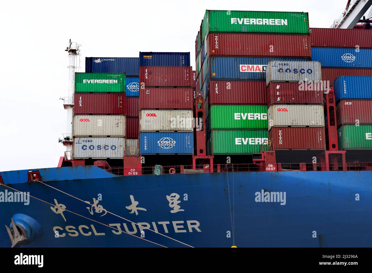 QINGDAO, CHINA - APRIL 5, 2022 - Freighters load and unload goods at ...