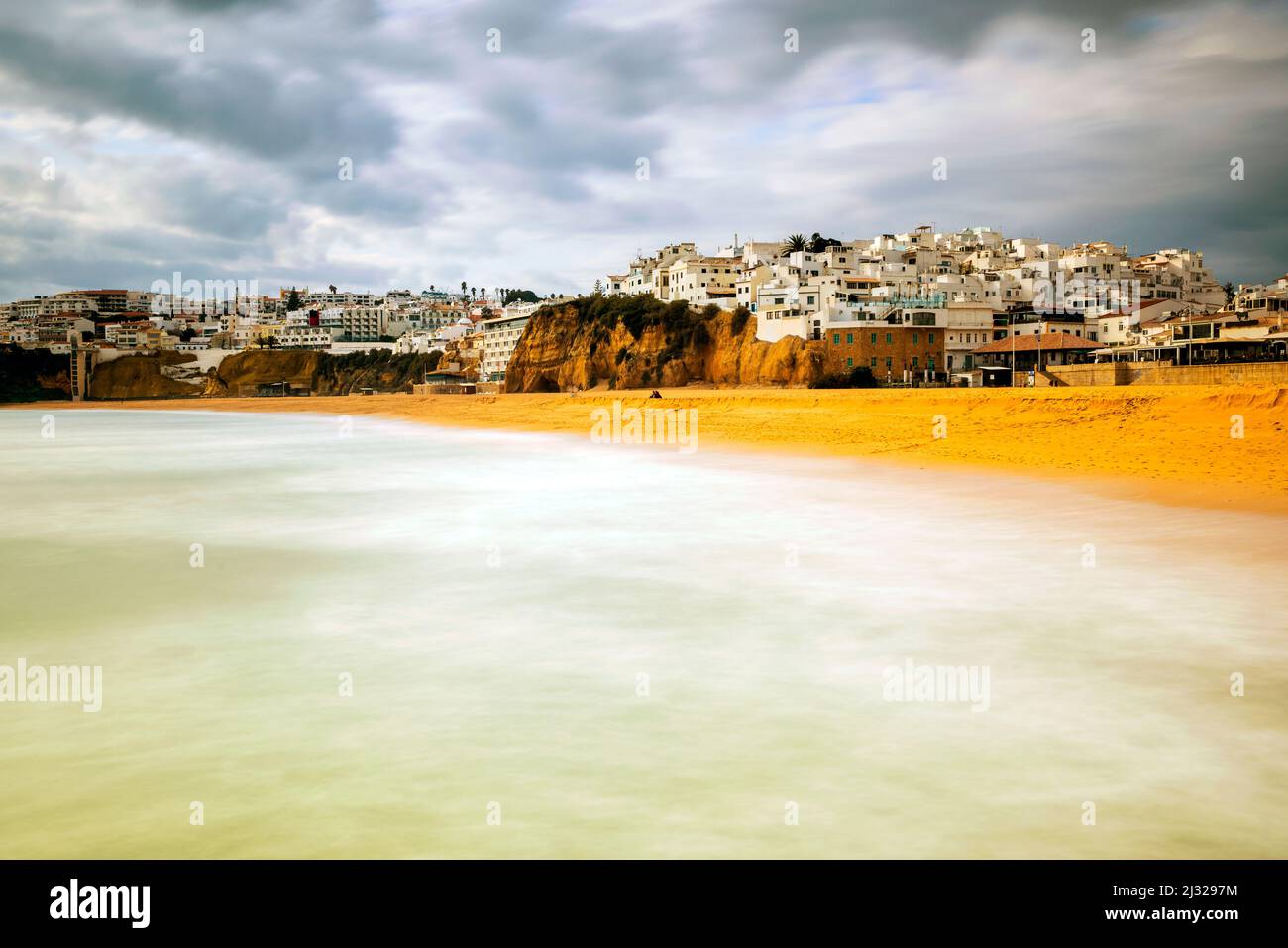 Dramatic view of old town and beach in Albufeira, Algarve, Portugal ...