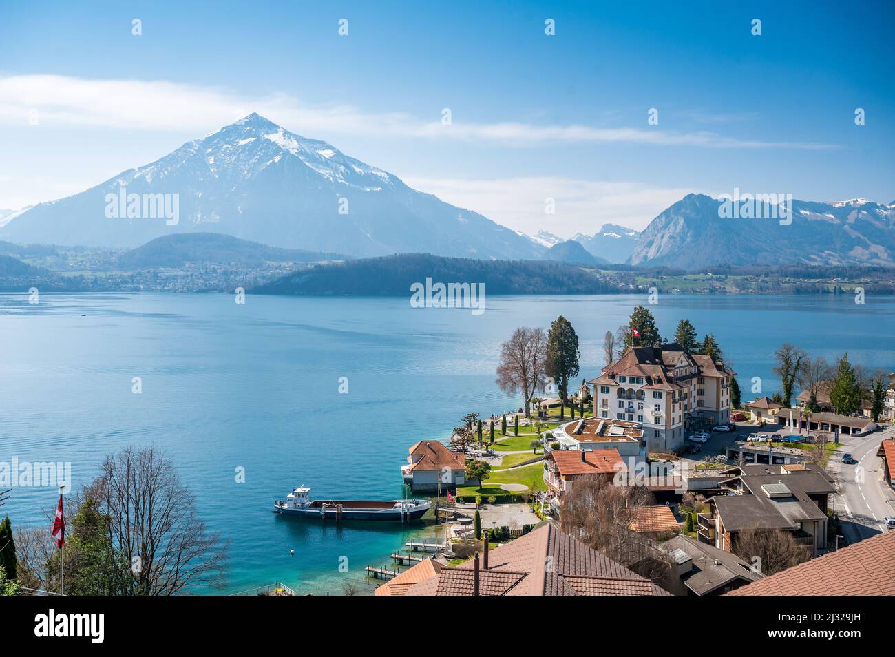 Lake Thun, Niesen and Parkhotel Gunten on a spring day seen from Gunten ...